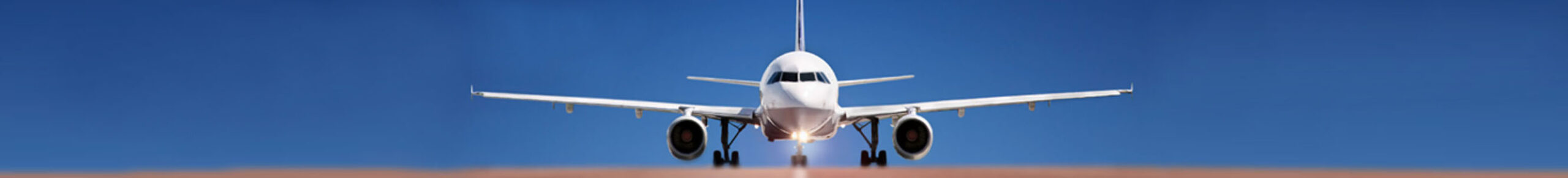 Airplane on runway with clear blue sky. - Jet Power Aviation